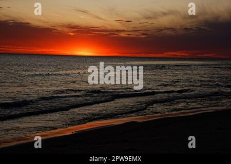 The setting sun in Bella Vista beach in Uruguay Stock Photo - Alamy