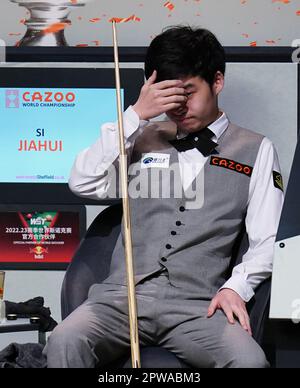 Si Jiahui reacts during his match against Luca Brecel (not pictured) on day fifteen of the Cazoo ...