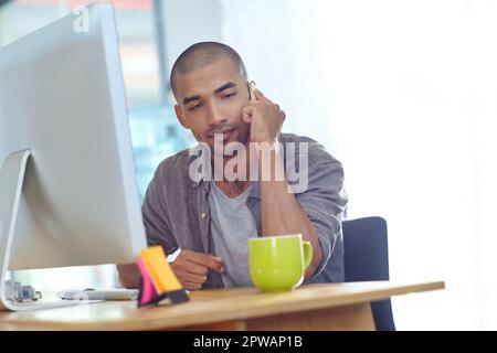Go on, Im listening. a young call centre agent sitting alone in her ...