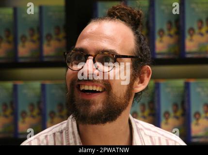 Author Nicholas Brooks with the novel 'An Island's Eleven: The Story of ...