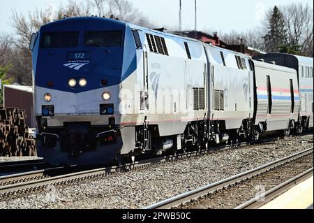 Amtrak passenger train passing through downtown Seattle waterfront ...