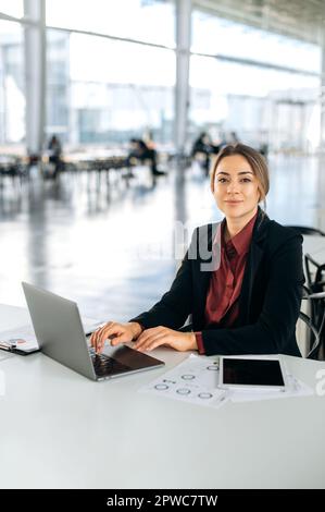 Photo of positive smiling programmer wear spectacles having work done ...
