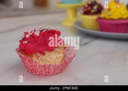 Failed cupcake with cream on light table. Troubles happen Stock Photo ...