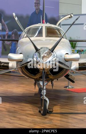 The front part of the aircraft with the propeller, with silver engine ...
