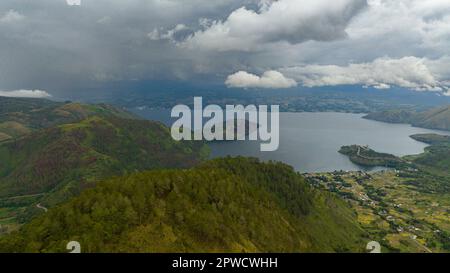 Lake Toba and Samosir island among the mountains with tropical ...