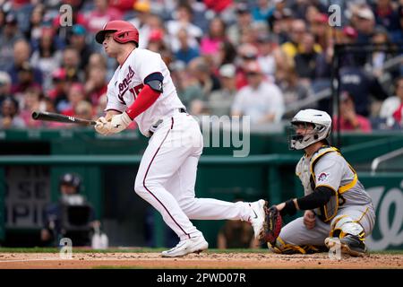 Washington Nationals' Riley Adams swings during an at-bat in front of ...