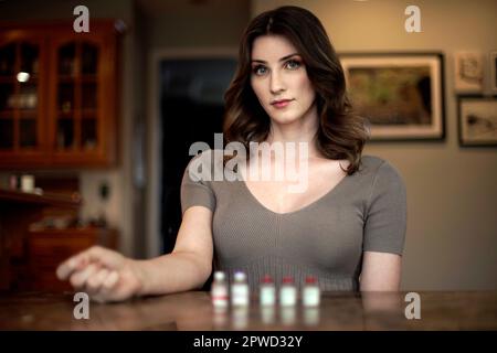 Transgender woman Stacy Cay displays some of the hormone therapy drugs ...