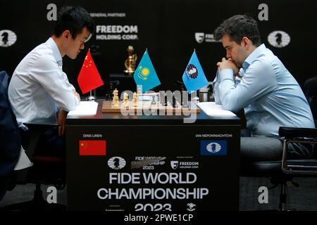 Russia's Ian Nepomniachtchi, right, and China's Ding Liren play during ...