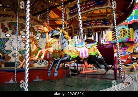 Daytime British colorful carnival fair amusement park rides Stock Photo ...
