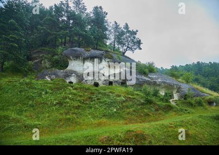 Big old cave houses from outside, rainy weather Stock Photo - Alamy