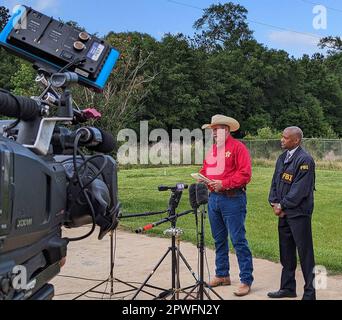 San Jacinto County Sheriff Greg Capers talks to investigators at the ...