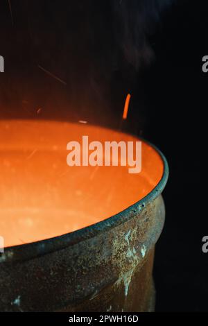 fire burning inside a metal barrel Stock Photo - Alamy