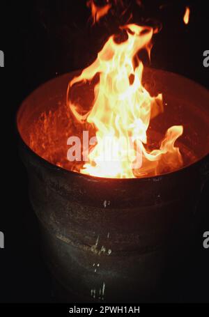 fire burning inside a metal barrel Stock Photo - Alamy