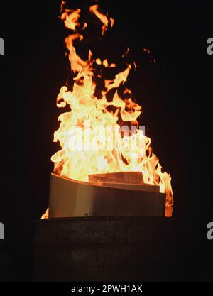 fire burning inside a metal barrel Stock Photo - Alamy