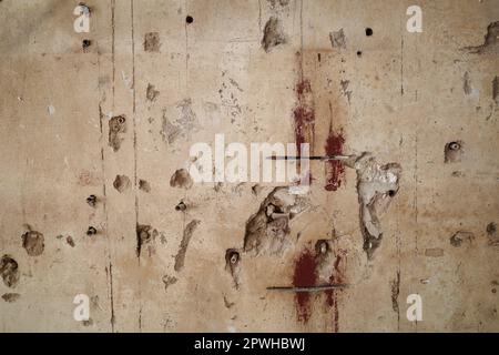 Rough concrete structural wall with scar of cracking plaster and stucco ...