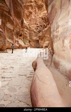 Ancient water conduit in Siq, canyon, gorge, ancient paving stones ...