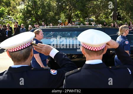 The herse carrying the casket of Steven Tougher makes it’s way through ...