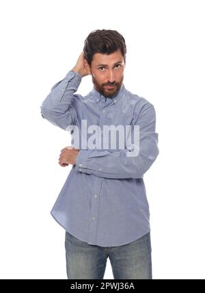 Embarrassed man in shirt on white background Stock Photo - Alamy