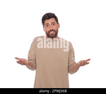Embarrassed man in pullover on white background Stock Photo - Alamy