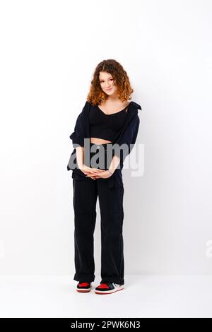 Cute teenager girl girl pretends to be embarrassed Stock Photo - Alamy