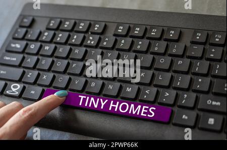 Sign displaying Tiny Homes. Business approach houses contain one room ...
