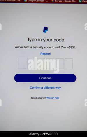 Paypal security code on mobile and computer screen, payment safety ...