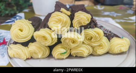 Chocolate coated churros with cream filling. Spanish churros ready to ...