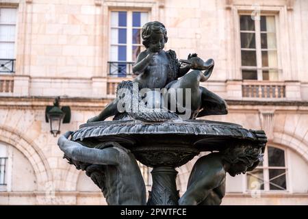 Ornamental fountain at the Sainte-Croix Square, across the Sainte-Croix ...