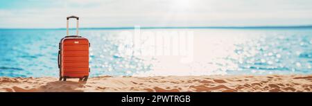Panoramic view of the seacoast with suitcase on the sandbeach Stock ...