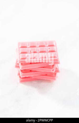 Homemade mini pink chocolates in a food glass container Stock Photo - Alamy
