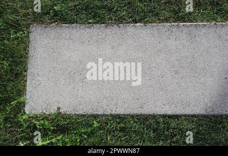 grey concrete tiles path in the grass Stock Photo - Alamy