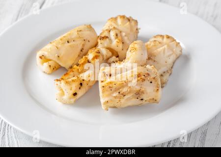 Portion of fried asian style calamari on the plate Stock Photo - Alamy