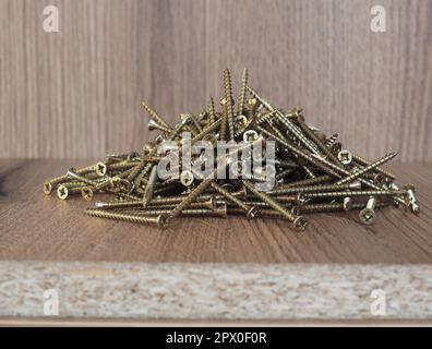 wood screws on melamine manufactured wood panel Stock Photo - Alamy