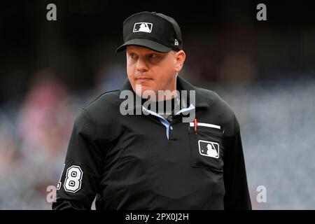 Umpire Ryan Wills walks on the field during a baseball game between the ...