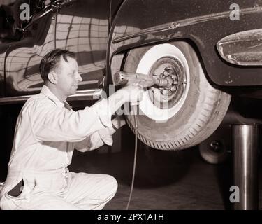 Professional Caucasian Classic Cars Mechanic Taking a Look on a Muscle ...