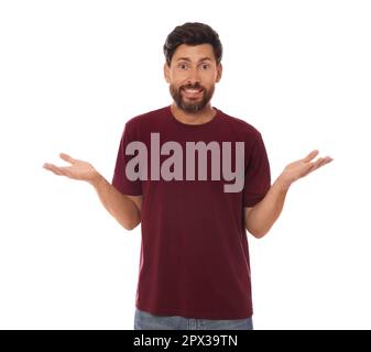 Embarrassed man in shirt on white background Stock Photo - Alamy