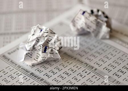 Crumpled lottery tickets as symbol of losing the lottery game. Unlucky ...