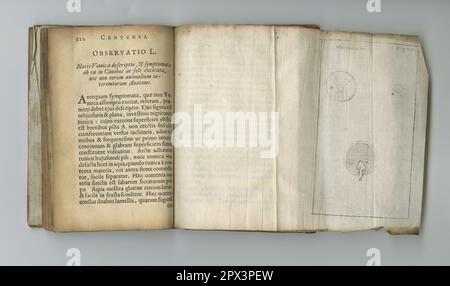 Old and weather-beaten journal. An antique book with its pages on ...