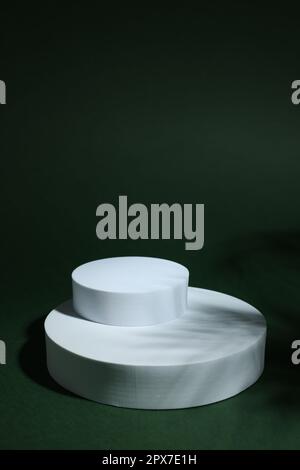 Product photography props. Round shaped podiums and wooden mannequin on ...