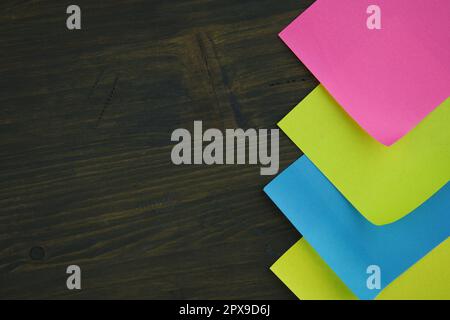 attached yellow note with free text blue background Stock Photo - Alamy