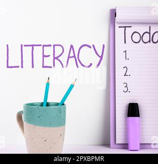 Hand writing sign Literacy. Business overview ability to read and write ...