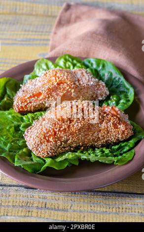 Portion of Sesame Crusted Salmon on lettuce Stock Photo - Alamy