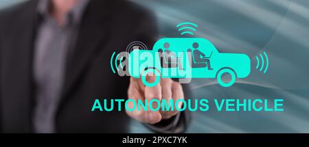 Man touching an autonomous vehicle concept on a touch screen with his ...