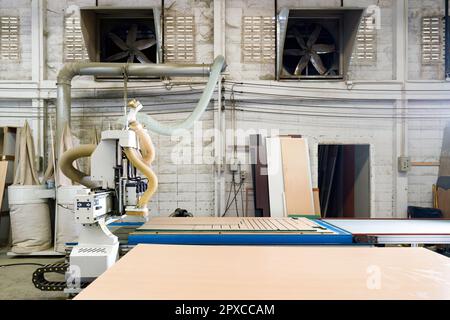 Working table fully loaded with plywood in industrial factory producing ...