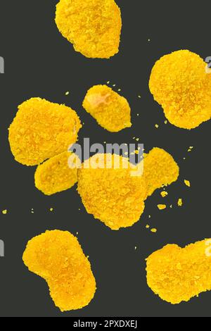 Falling chicken nuggets isolated on a white background, clipping path ...