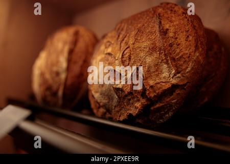 Golden brown crust with flour dusting on textured white surface. Soft ...