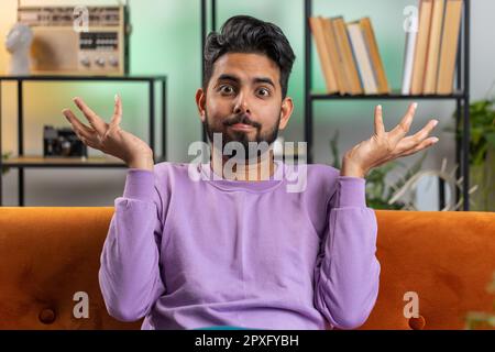 I dont know what to say. Confused indian handsome man feeling ...