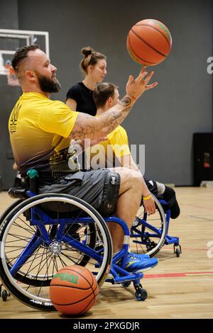 Disabled Athlete spinning basketball ball with finger. Handicapped ...