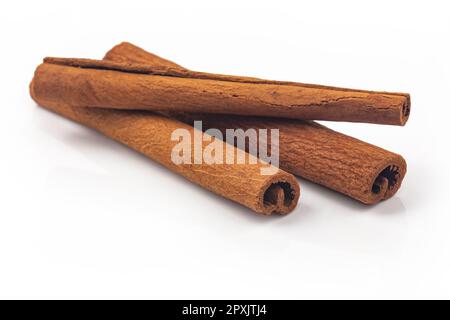 Dried Cinnamon sticks isolated over white background Stock Photo - Alamy