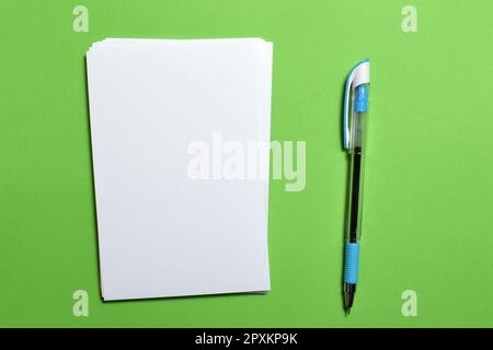 Stack of white square sheets of paper for notes, stationery on blue ...